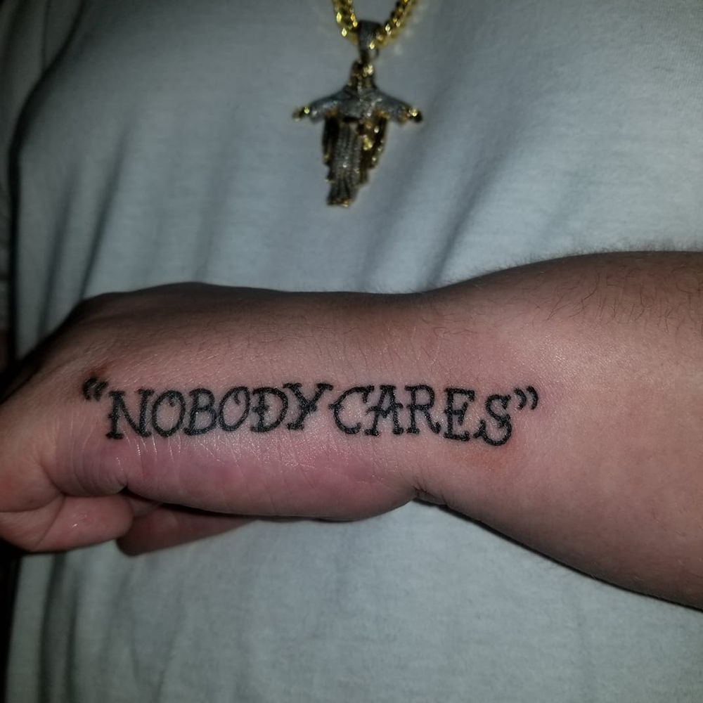 Nobody Symbol Tattoo