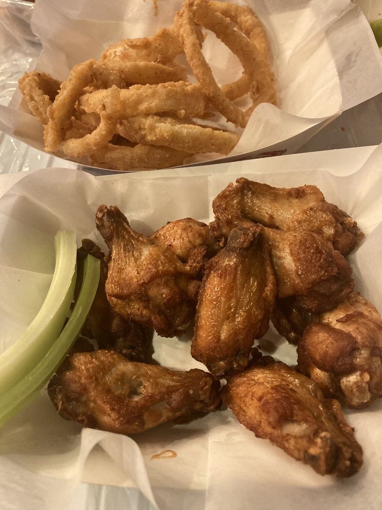 Wing and onion rings at Pier 88 - Yelp