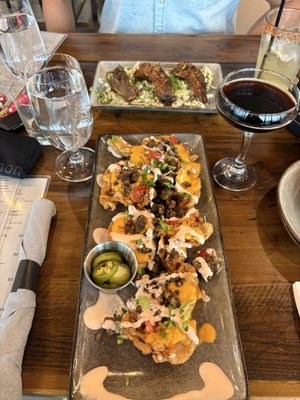 Photo of Reno Bar and Grill - Reno, NV, US. Chicken skin nachos and ribs