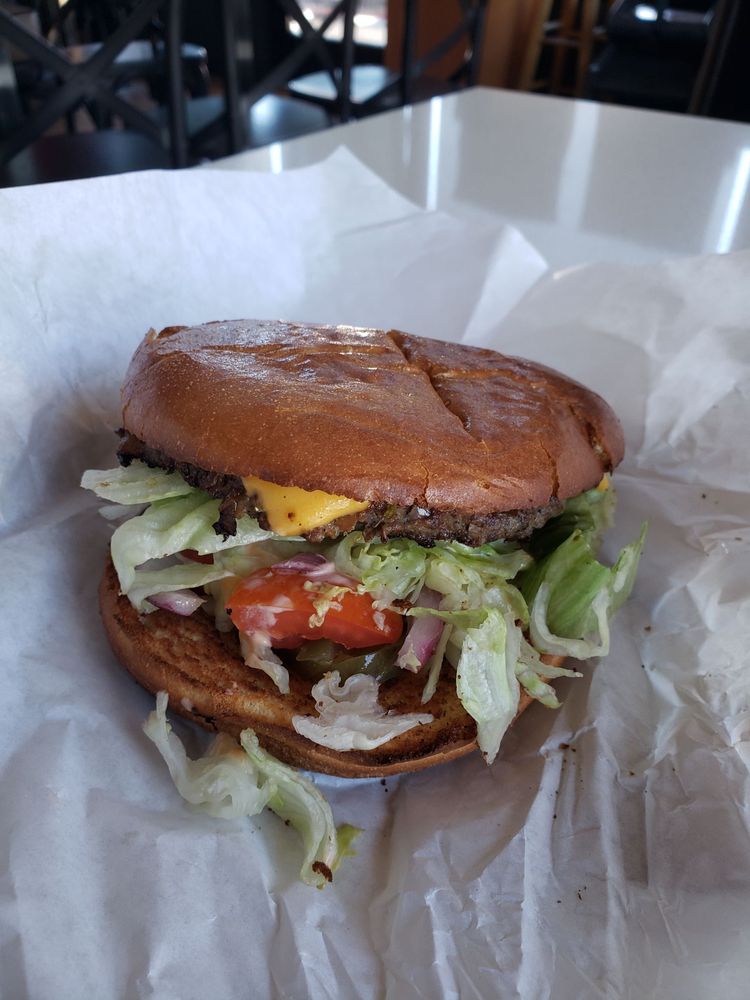 Chapli burger comes with onions ( menu doesn't say) - Yelp